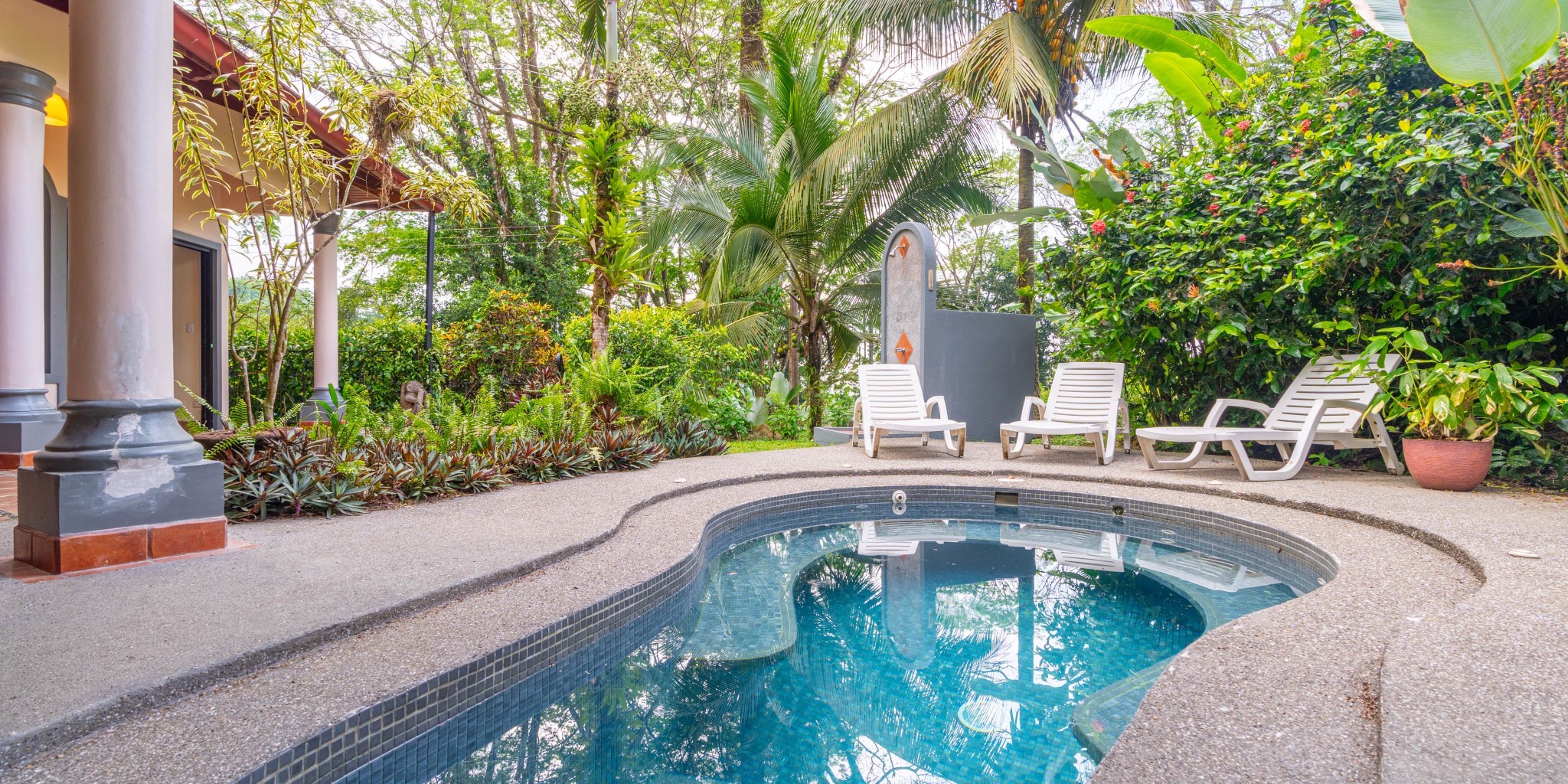 Peaceful 4-Bedroom Home with Open Air Layout in Jungle Covered Gated ...