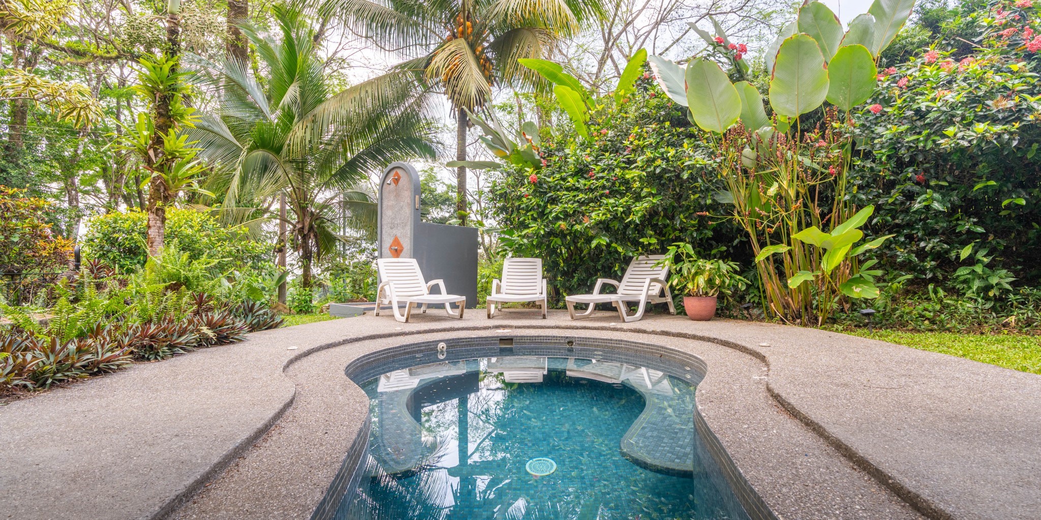 Peaceful 4-Bedroom Home with Open Air Layout in Jungle Covered Gated ...